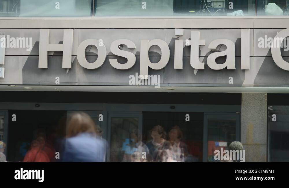 Public hospital entrance with people and hospital sign. 4K Time Lapse ...
