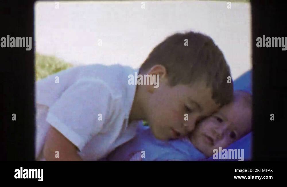 1957: Brother cuddling nuzzle against baby boy brother smushed face ...