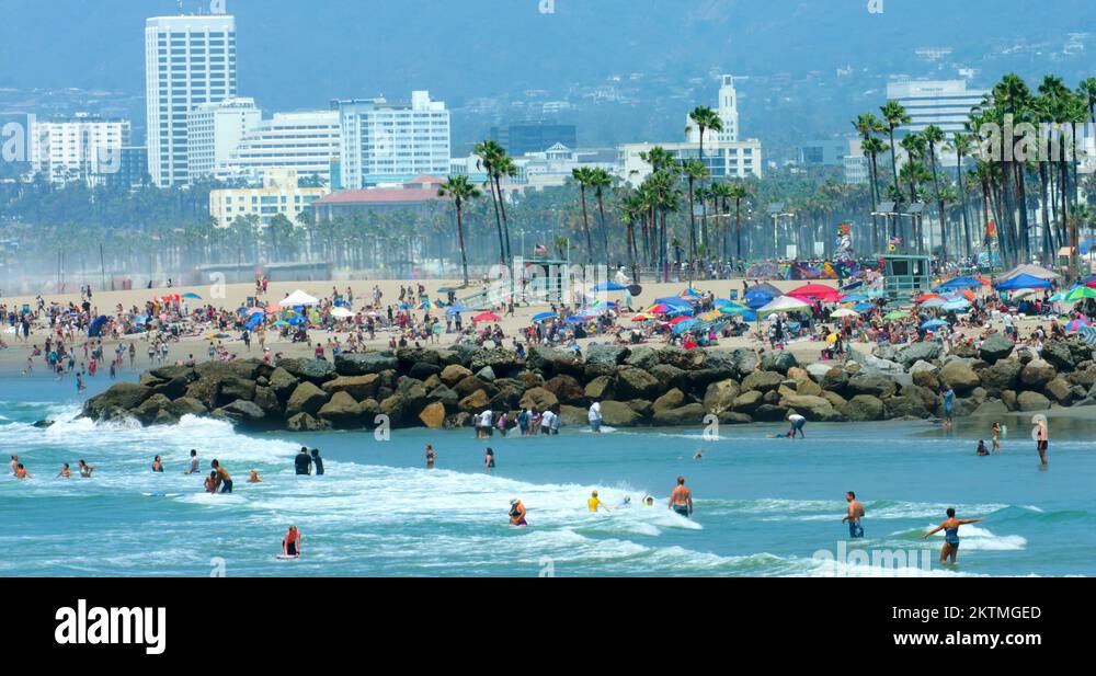 People swim in the Pacific Ocean in Venice Beach in Los Angeles ...