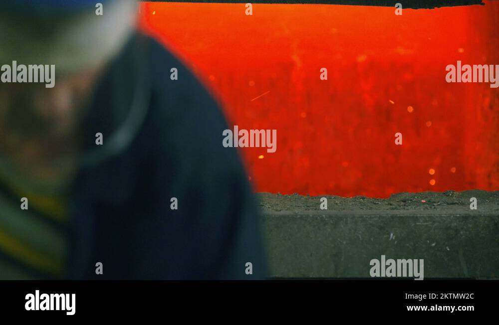 Steelmaker throws the ore to the smelting furnace Stock Video Footage ...