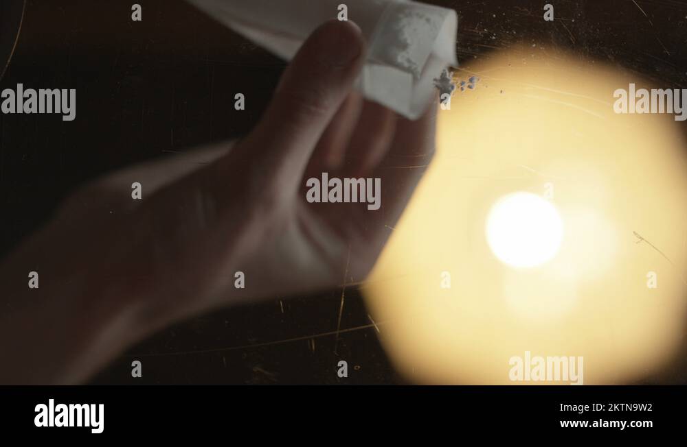 4K Drug addict cutting & snorting lines of cocaine with rolled bank ...