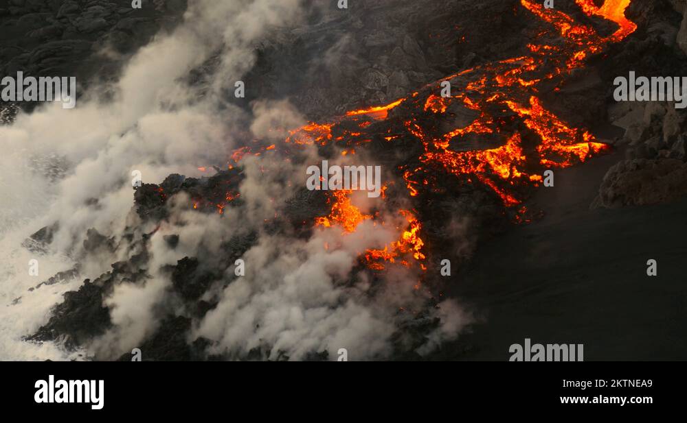 Volcanic Eruption Lava flowing into the water Hawaii Stock Video ...