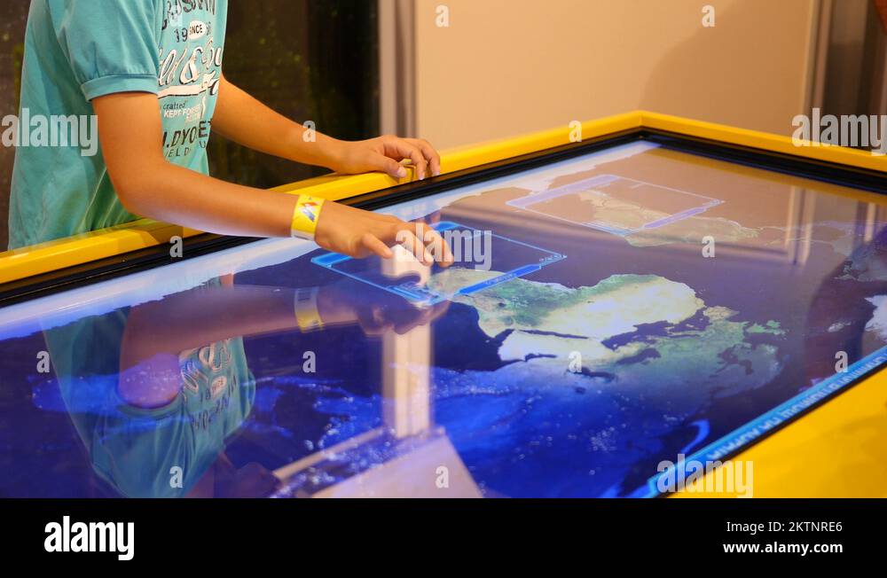 Kid boy type slide educational geographical multimedia table touchscreen display Stock Video ...