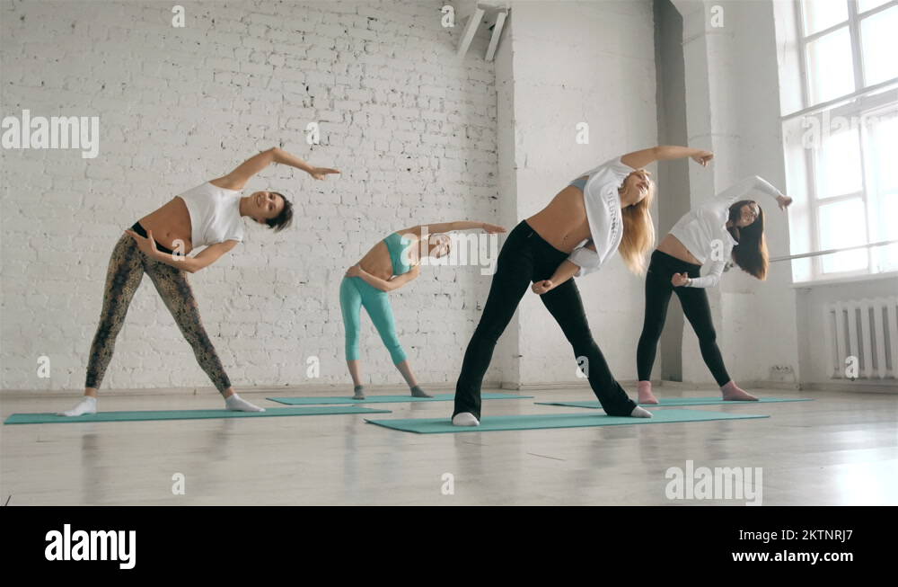 Young Girls Doing Yoga, Group of People In a Stretching Class, Healthy ...