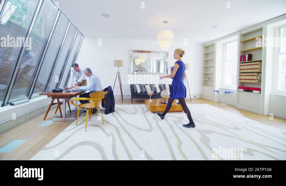 4K Businessman or CEO working at his desk with the support of two ...