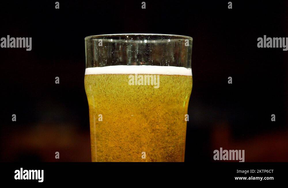 FIZZY PINT OF LAGER BEER SCARBOROUGH ENGLAND Stock Video Footage - Alamy