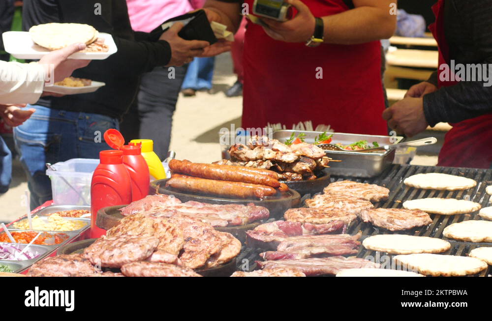 People buy meat dishes grilled on big street food festival in Sofia ...