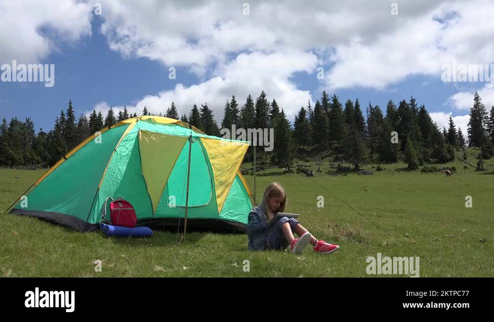 4K Child Playing Tablet at Camping in Mountains, Girl Using PC Outdoor ...
