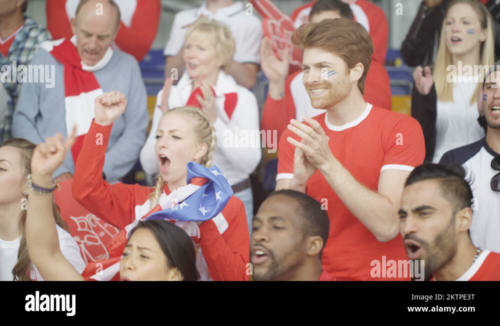 4K Crowd of spectators watching sports game in stadium cheering on ...