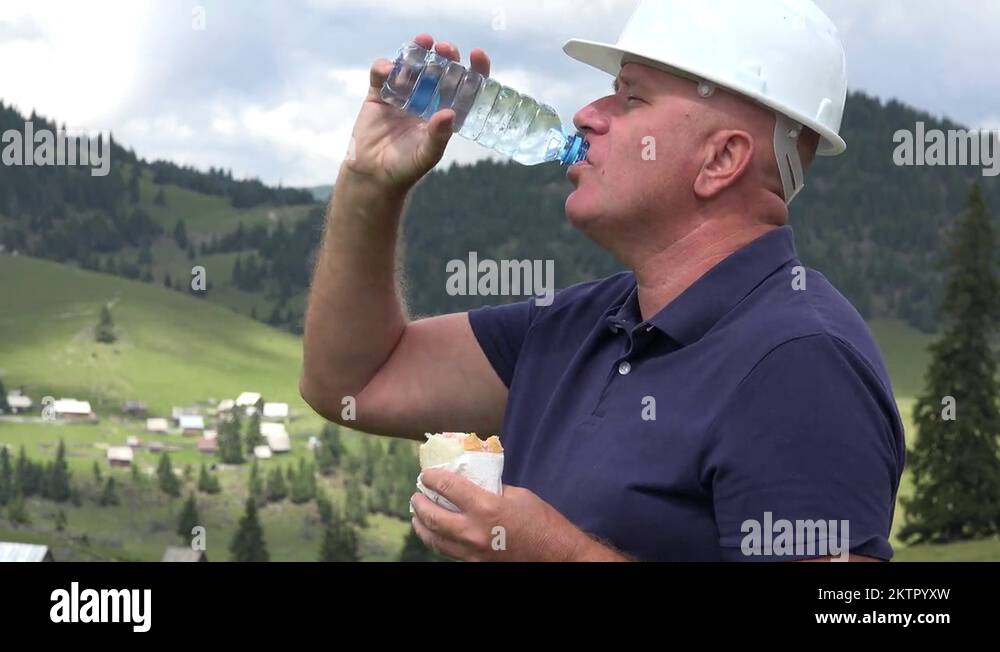 Engineer Working Break in Construction Site Eating Lunch and Drinking ...