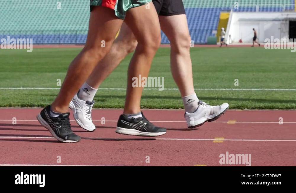 Strong healthy body legs people run on running stadium tracks during ...