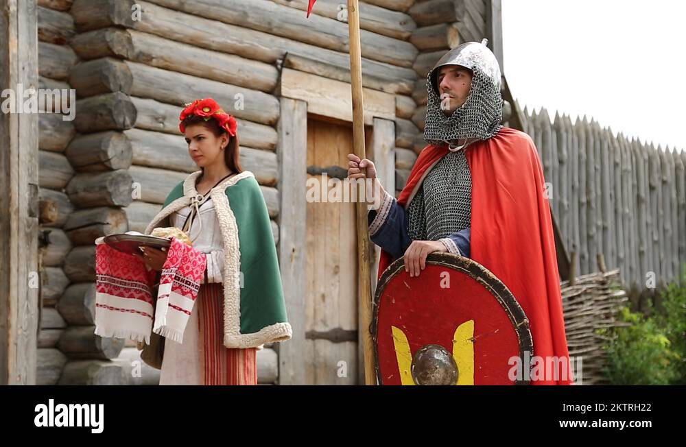 Woman and knight in armours in Kyivan Rus park, Kopachiv village ...