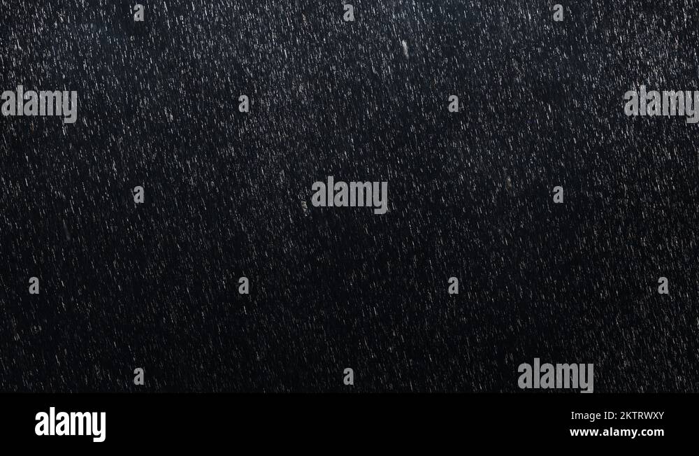 Falling raindrops in slow motion on dark background with start and end ...