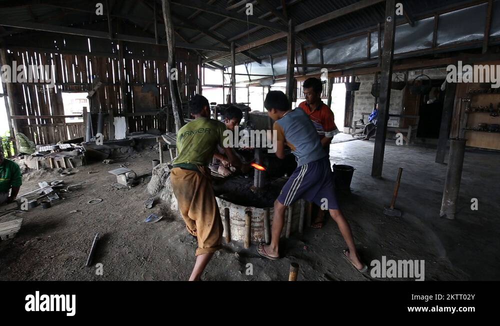 blacksmith create a sword by forging molten metal hit by hammer with ...