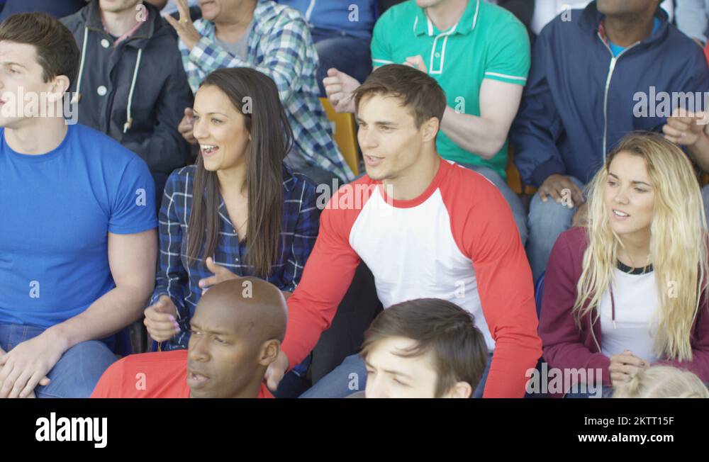 4K Excited supporter in sports crowd, celebrating & cheering on his ...