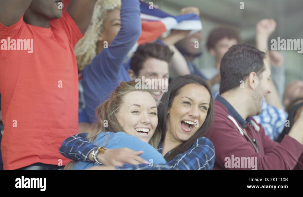 4K Excited fans with British flag in sports crowd celebrating ...