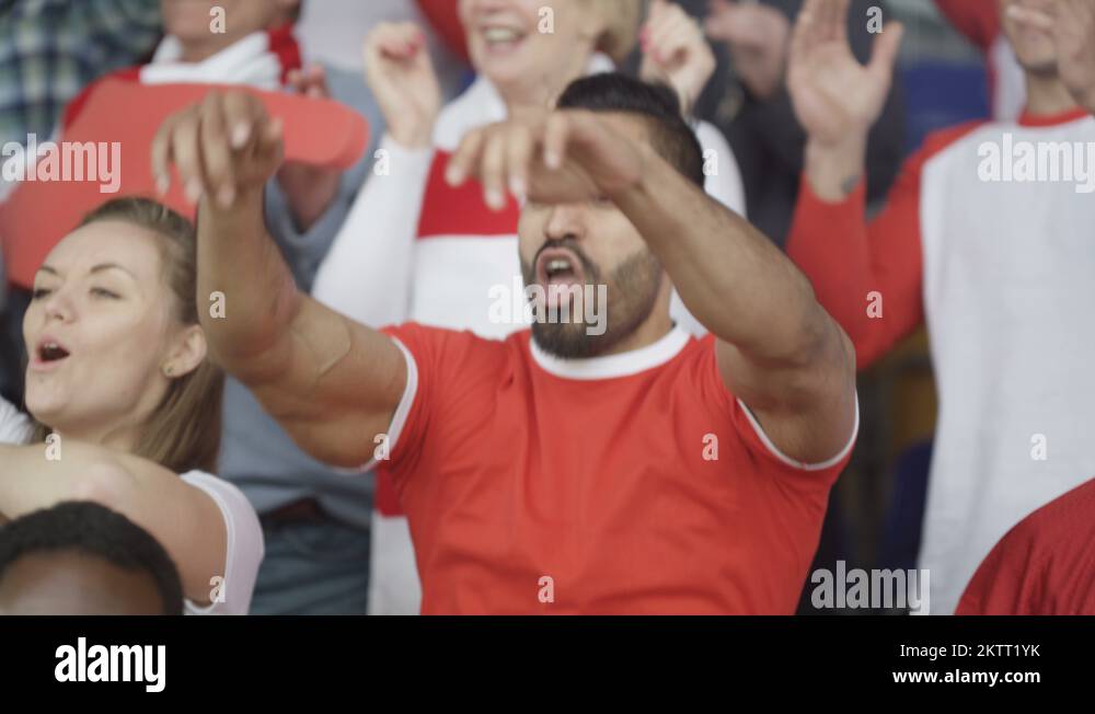 4K Excited supporter in sports crowd, celebrating & cheering on his ...