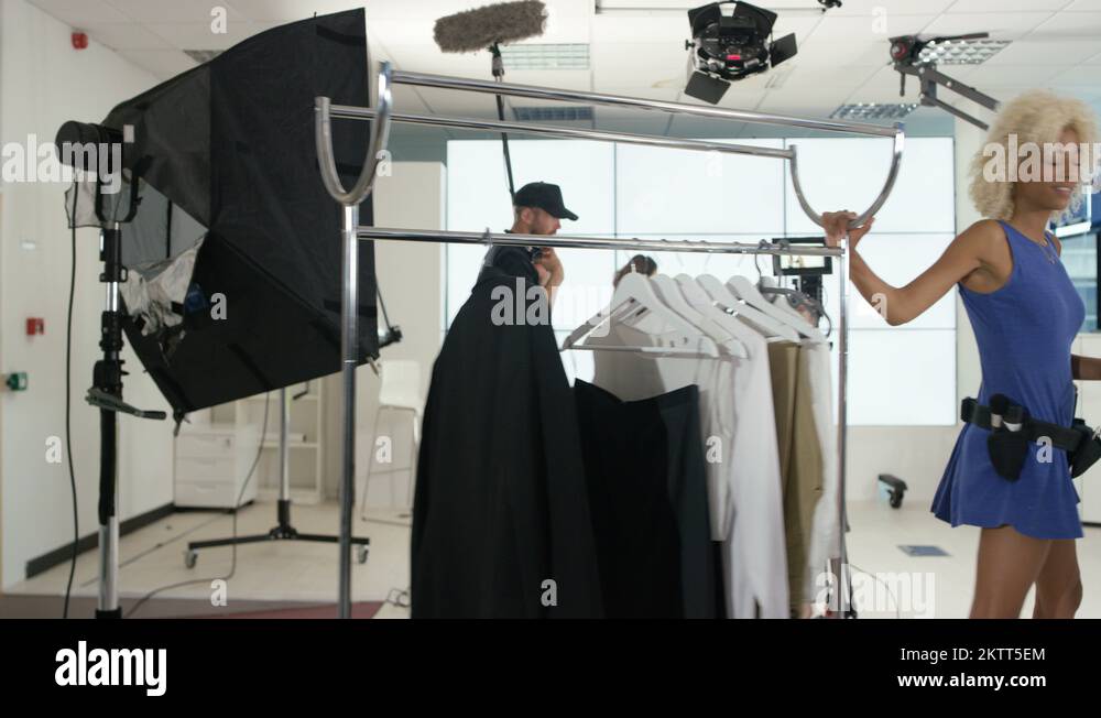 4K Crew member working behind the scenes on TV production set Stock ...