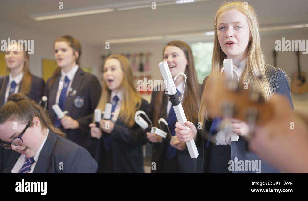 4K Group of teen girls playing percussion instruments in school music ...
