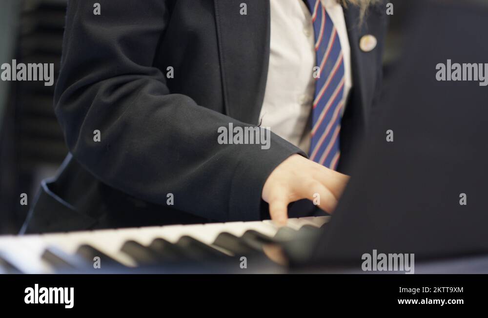 4K Teen girl singing solo & playing keyboard instrument in school music ...