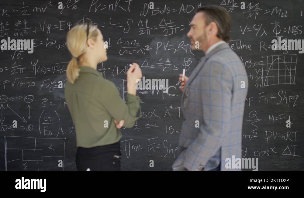 4K Portrait smiling academic man & woman studying math formulas on ...