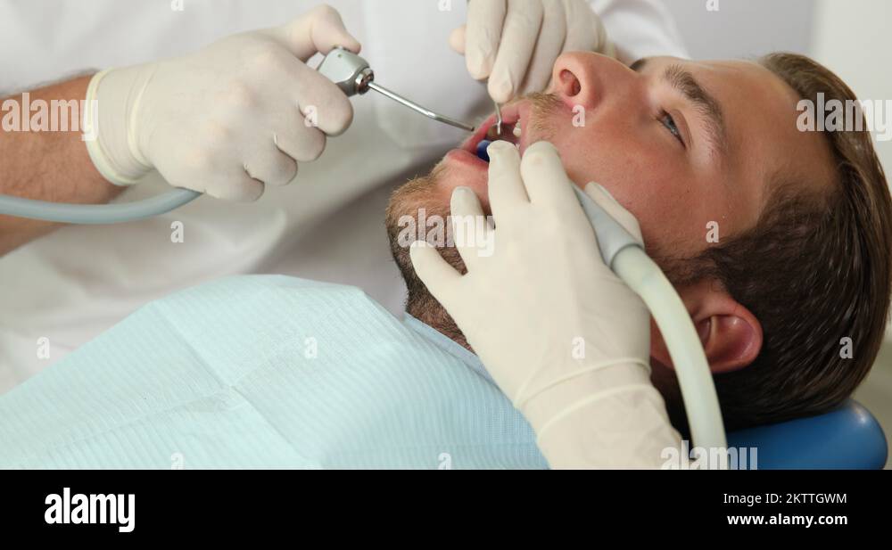Dentist Man Inspecting Cavity Using Washing Tools Cosmetic Cure Dental ...