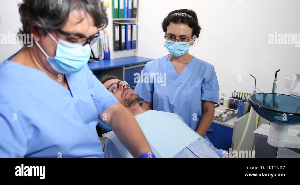 Dentist Man Pull Out Tooth Using Removal Tool Mouth Open Dental Medical ...