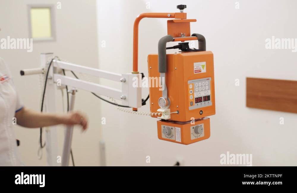 A woman setting up x-ray machine in clinic Stock Video Footage - Alamy