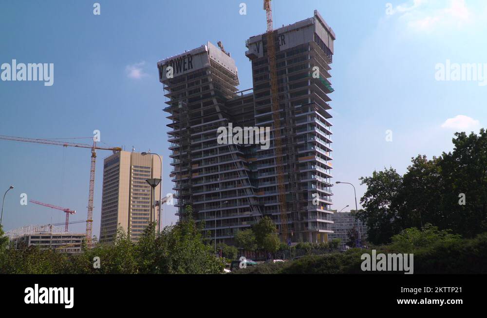 "V Tower" Building Time Lapse. Cranes, roof work, and lift. EDITORIAL ...
