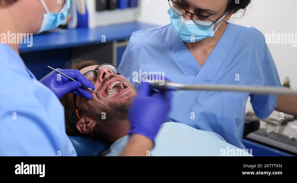 Medical Doctor Dentist Man Tooth Treatment Examining Mouth Open Dental ...