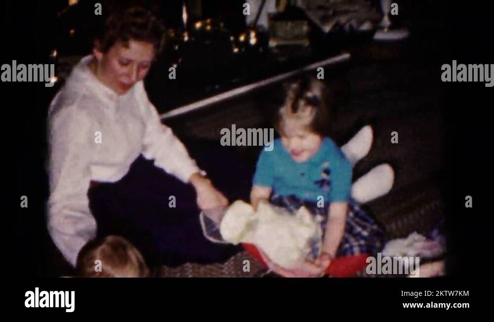 1959: a little girl and a baby inside on the floor playing as their ...