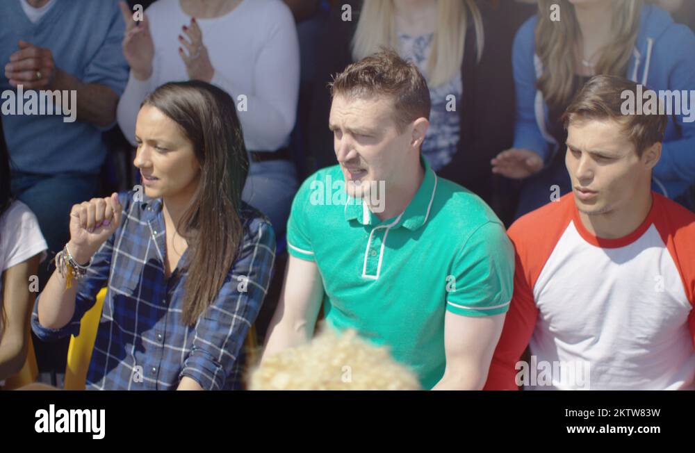 4K Excited supporter in sports crowd, celebrating & cheering on his ...