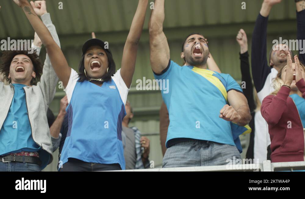 4K Excited sports fans at live event clapping & cheering for their team ...
