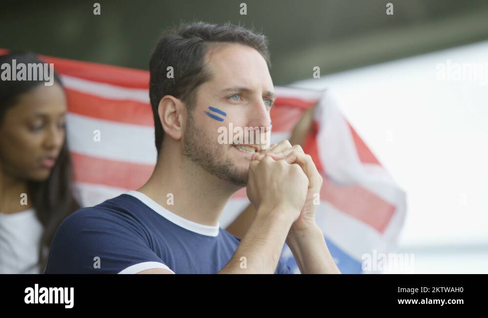4K Excited sports crowd with national flags cheering on their teams ...
