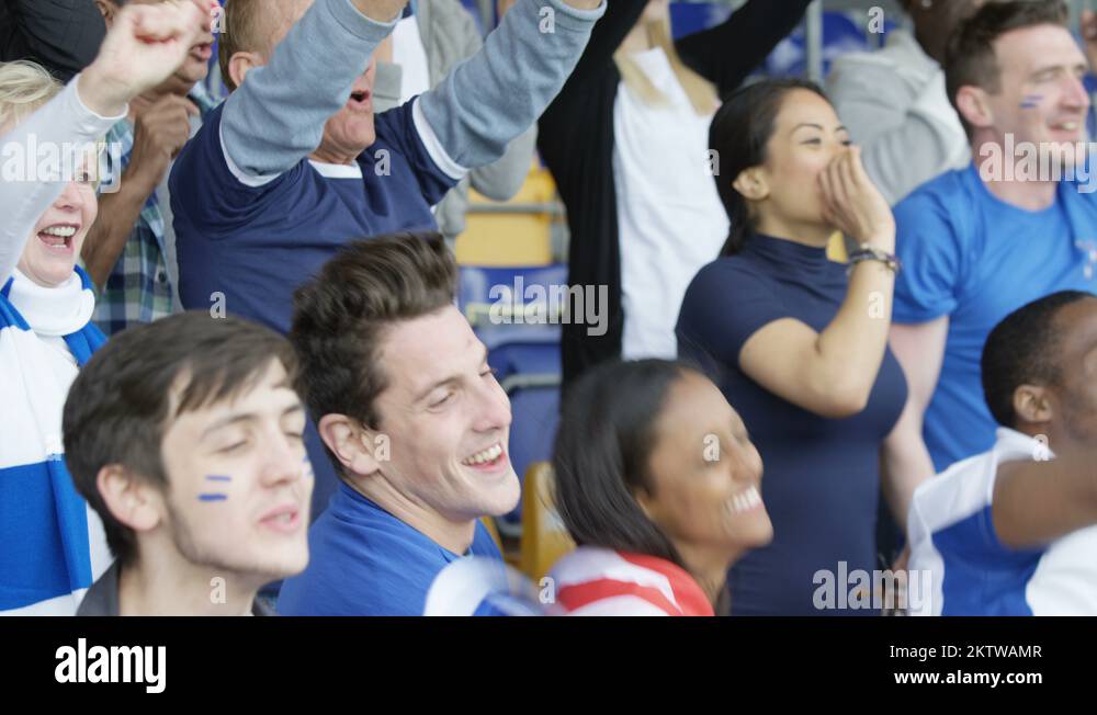 4K Excited sports crowd with national flags cheering on their teams ...