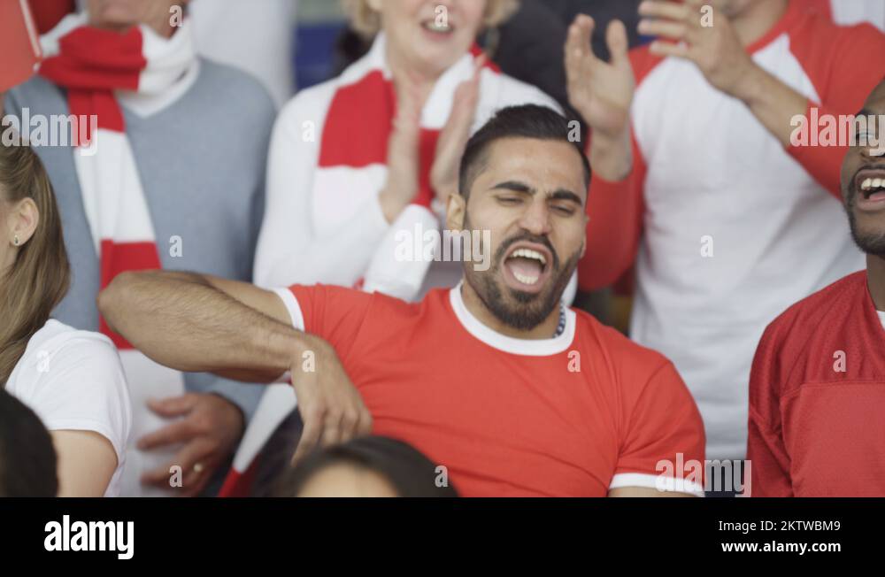 4K Excited fans with US flag in sports crowd, celebrating & cheering on ...