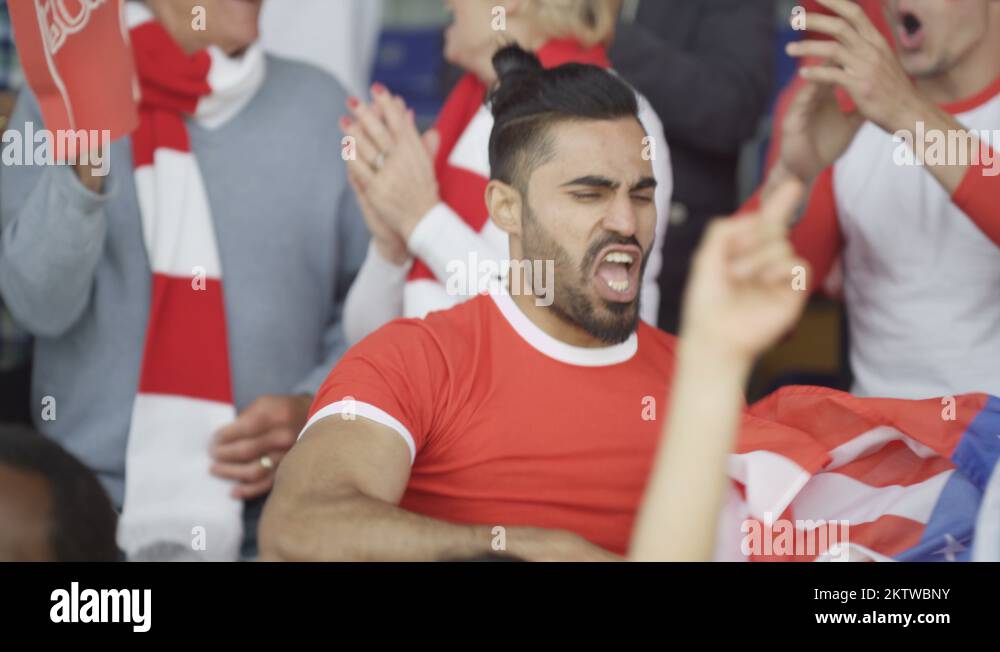 4K Excited fans with US flag in sports crowd, celebrating & cheering on ...