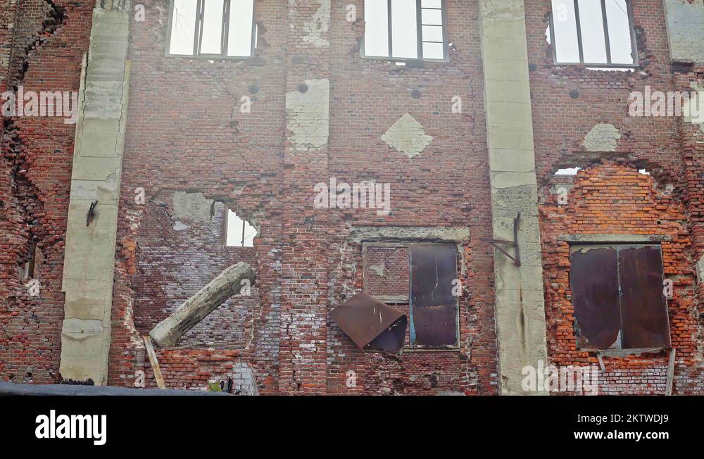 Old multi-storey building of brick in a state of devastation and ...