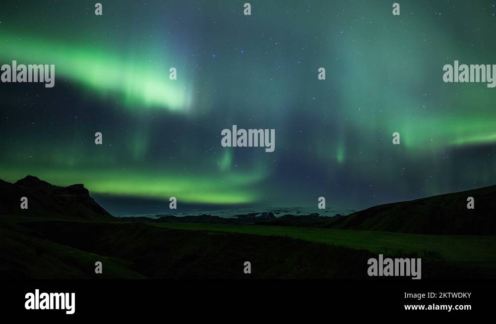 Aurora borealis northern lights over snow ice cap glacier Iceland ...