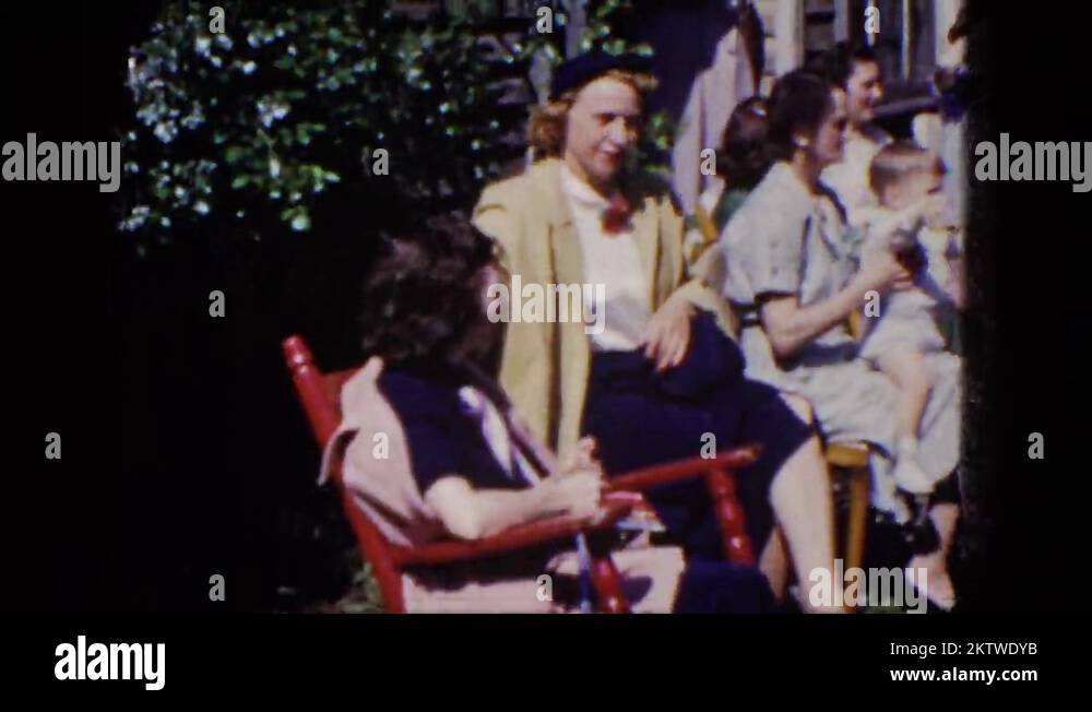 1964: group of women and children sitting outdoor watching other ...