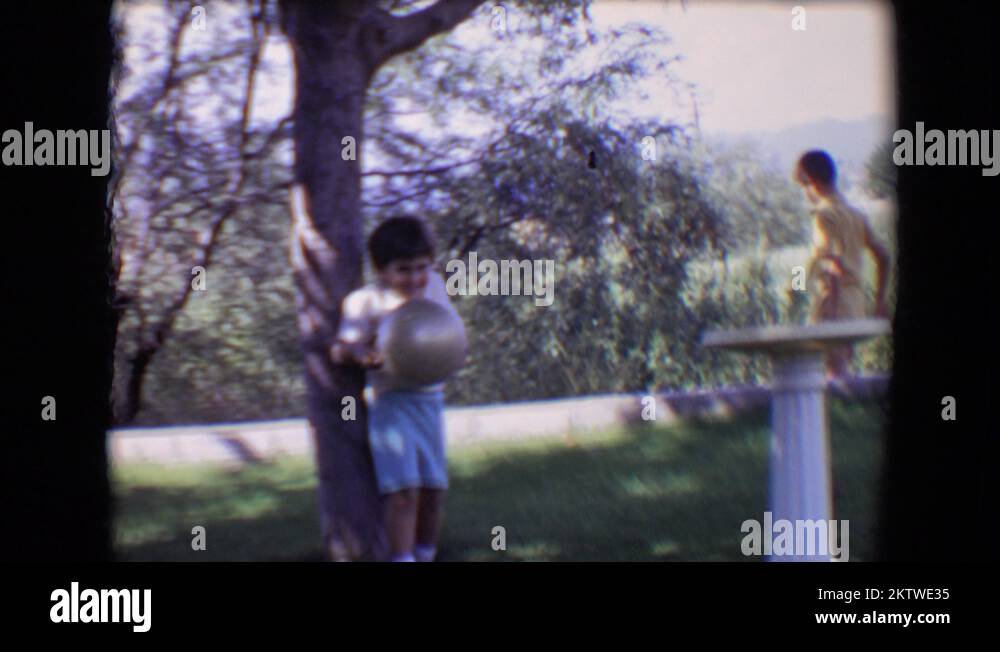 1967: young boy giggling while playing with a ball TUCSON, ARIZONA Stock Video Footage - Alamy