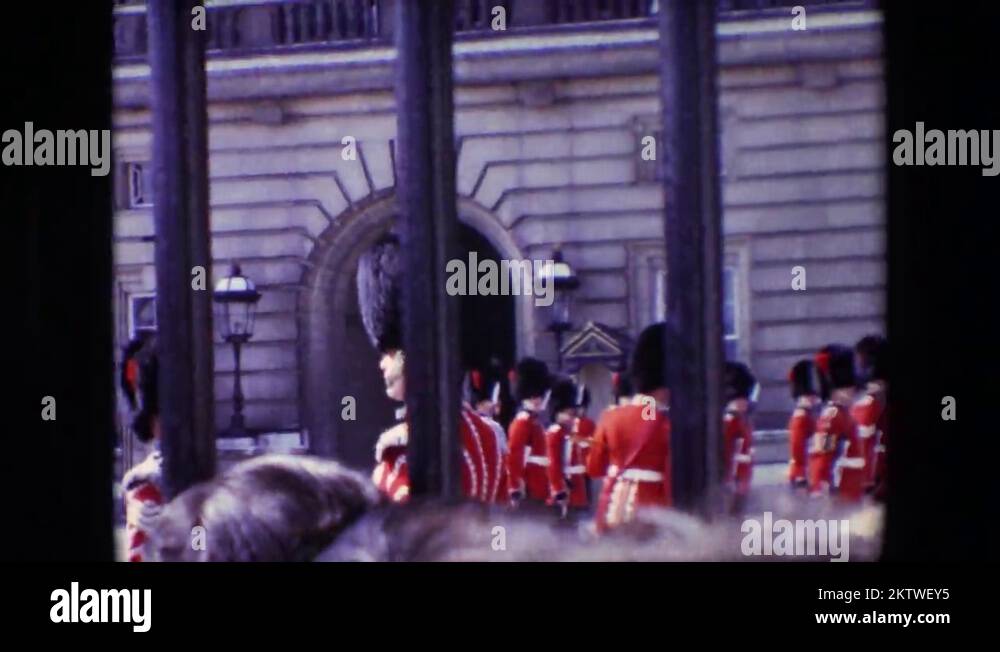 1969: old-fashioned dressed soldiers awaiting lined up in a courtyard ...
