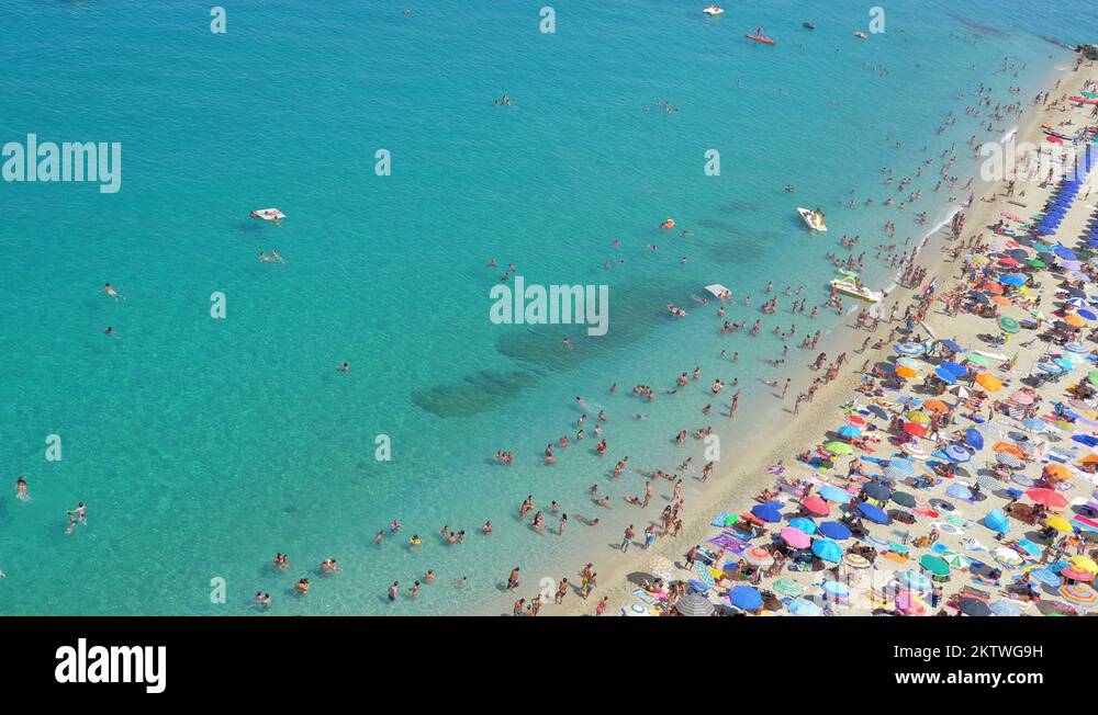 Tropea, Italy- sea, sun, beach and bathers in a typical Italian seaside ...