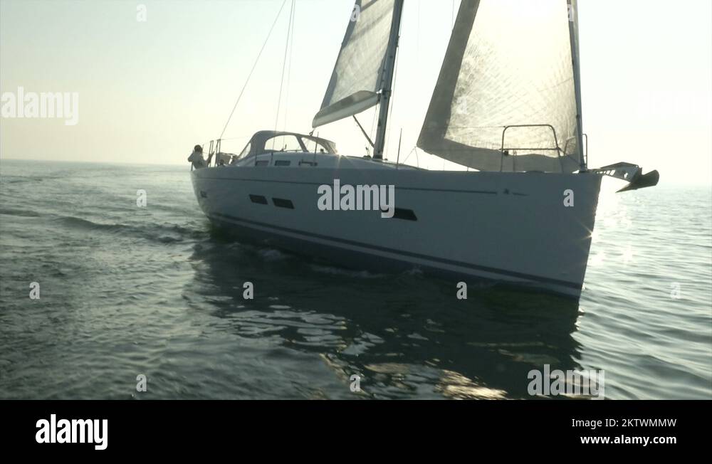 Sailing boat navigating with open sails Stock Video Footage - Alamy