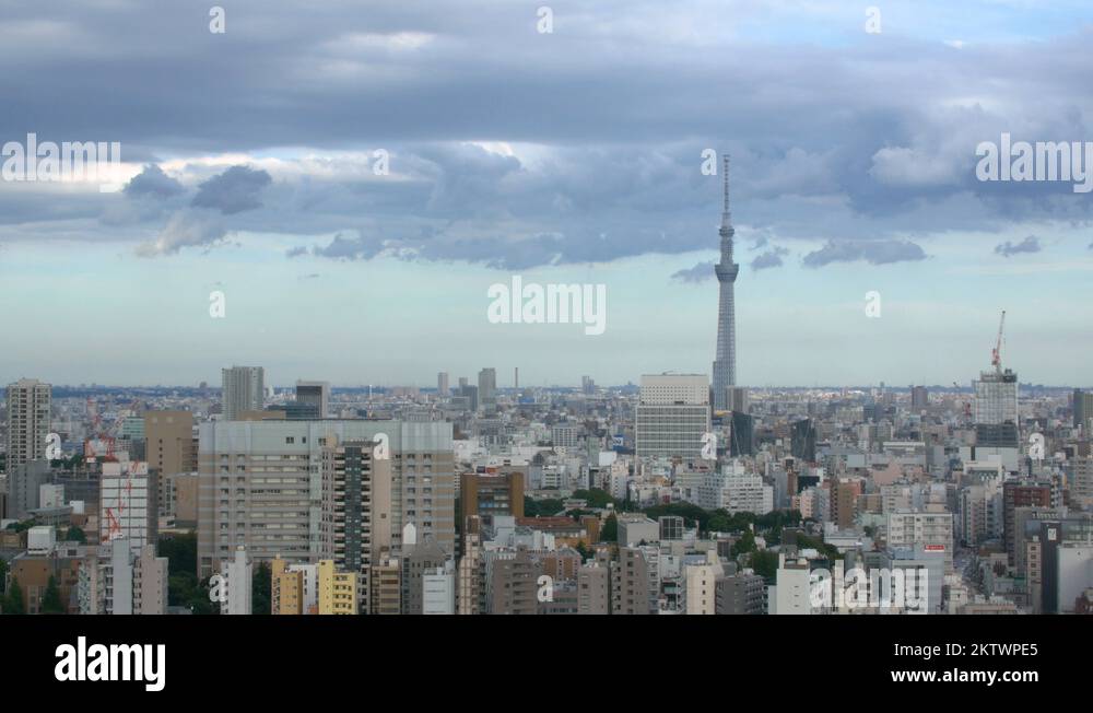 Bird's eye view of the dramatic sky over Tokyo cityscape before sunset ...