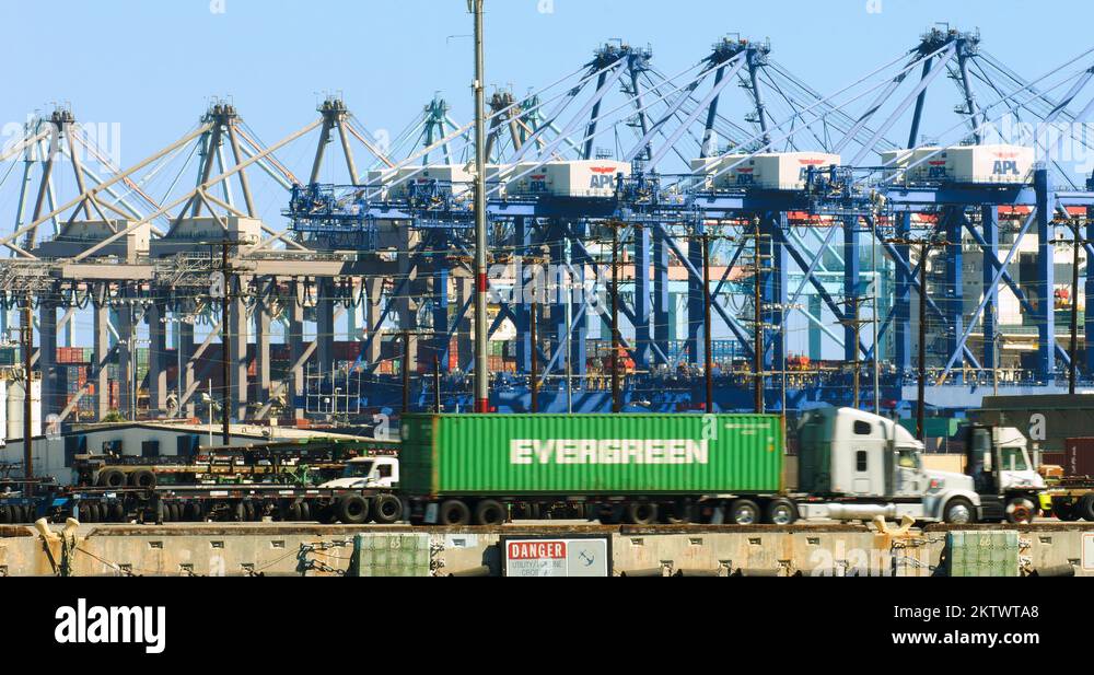Trucks move cargo containers at the sea port in Los Angeles port 4K RAW ...