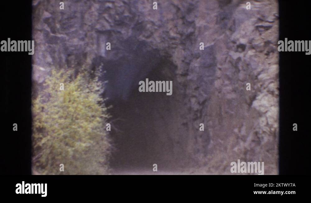 1968: passing into the deep dark cave where flora is sparing COLORADO SPRINGS Stock Video ...