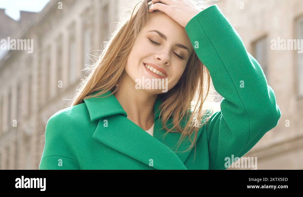 Cute woman poses, flirting and smiles in the city. Slowly Stock Video ...