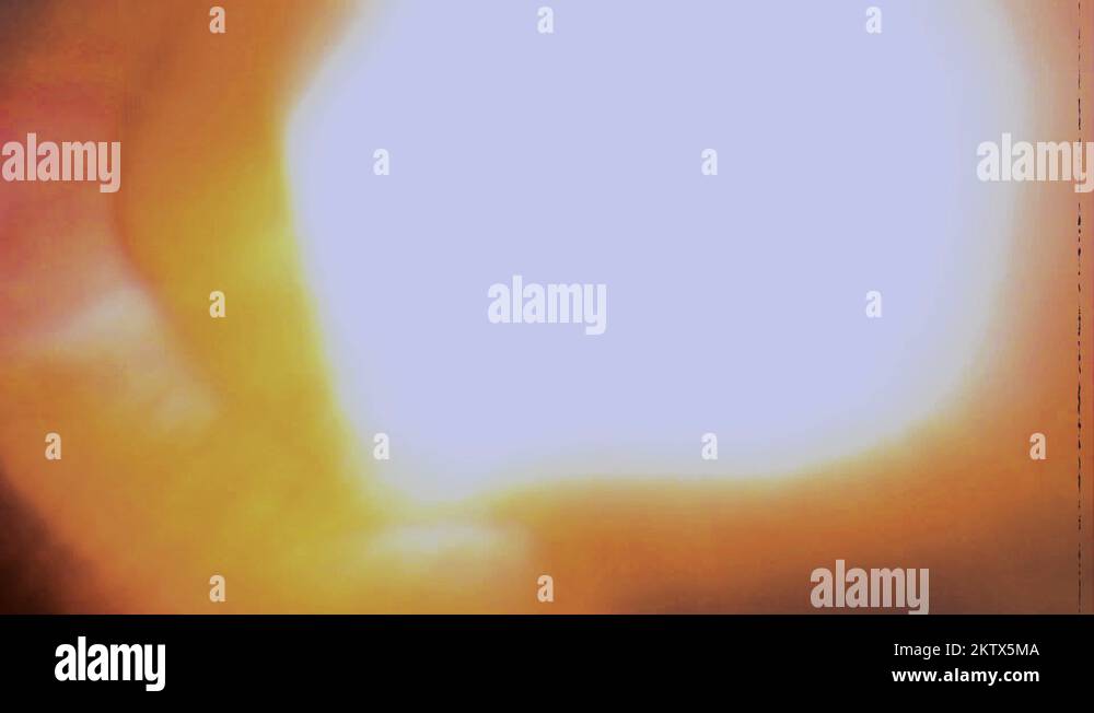 A flickering, analog TV signal with bad interference, static, and color ...