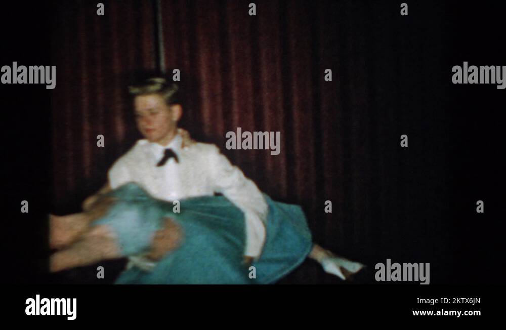 1965: handsome men and beautiful women are dancing for the song Stock ...